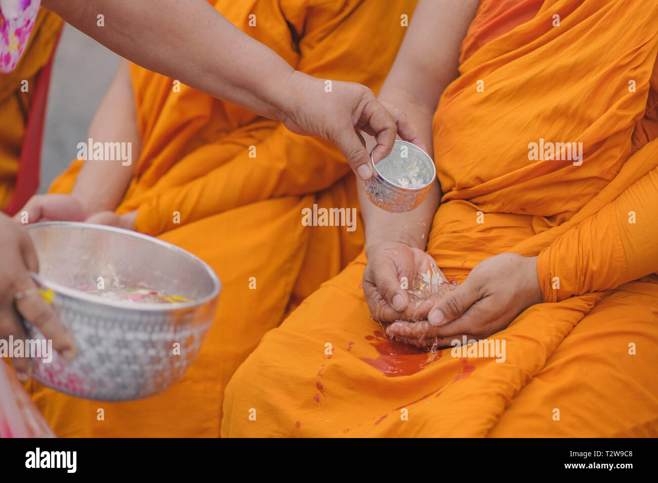 Hands pouring blessing water hi-res stock photography and images - Alamy