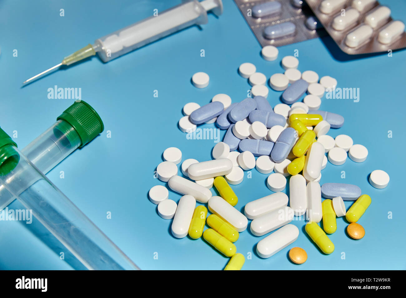 group of medications varied on a blue background of a pharmacy or a ...