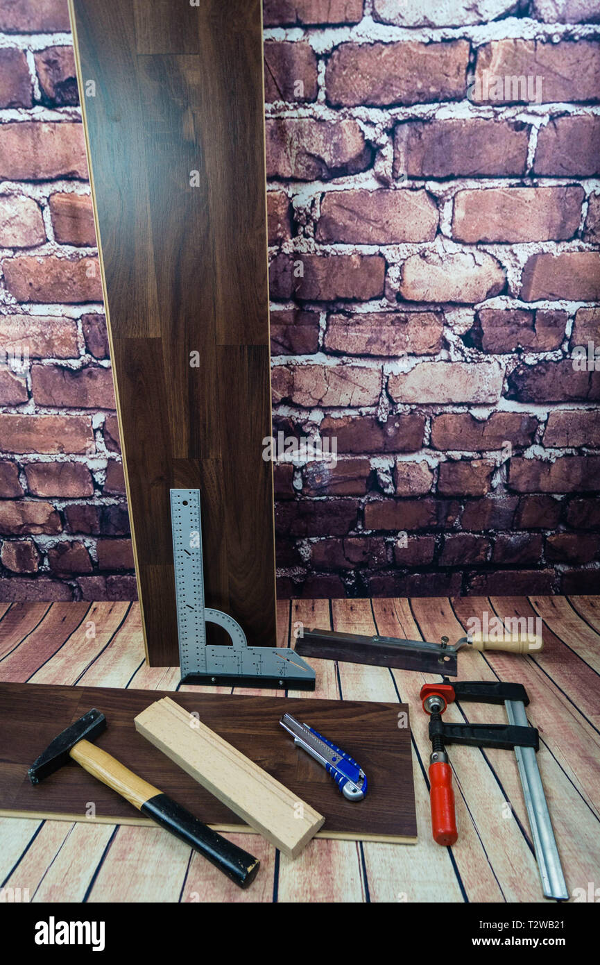 Tools for laying wooden Laminate or parquet on the floor Stock Photo ...