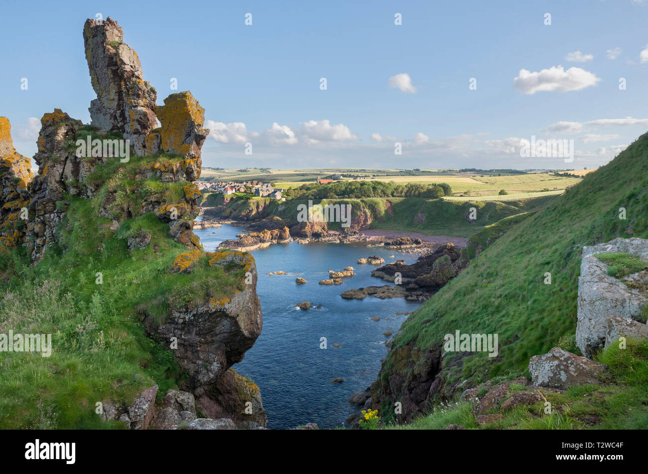 St Abbs coastal village viewed from the clifftop at White Heugh above ...