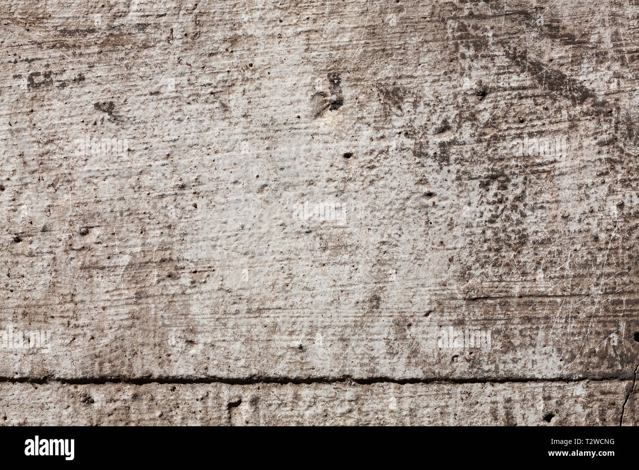 Concrete wall painted a long time, already with the paint stained by ...