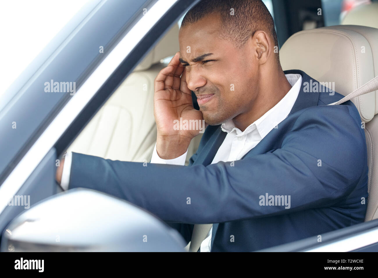 Young african american businessman driver sitting inside the car ...