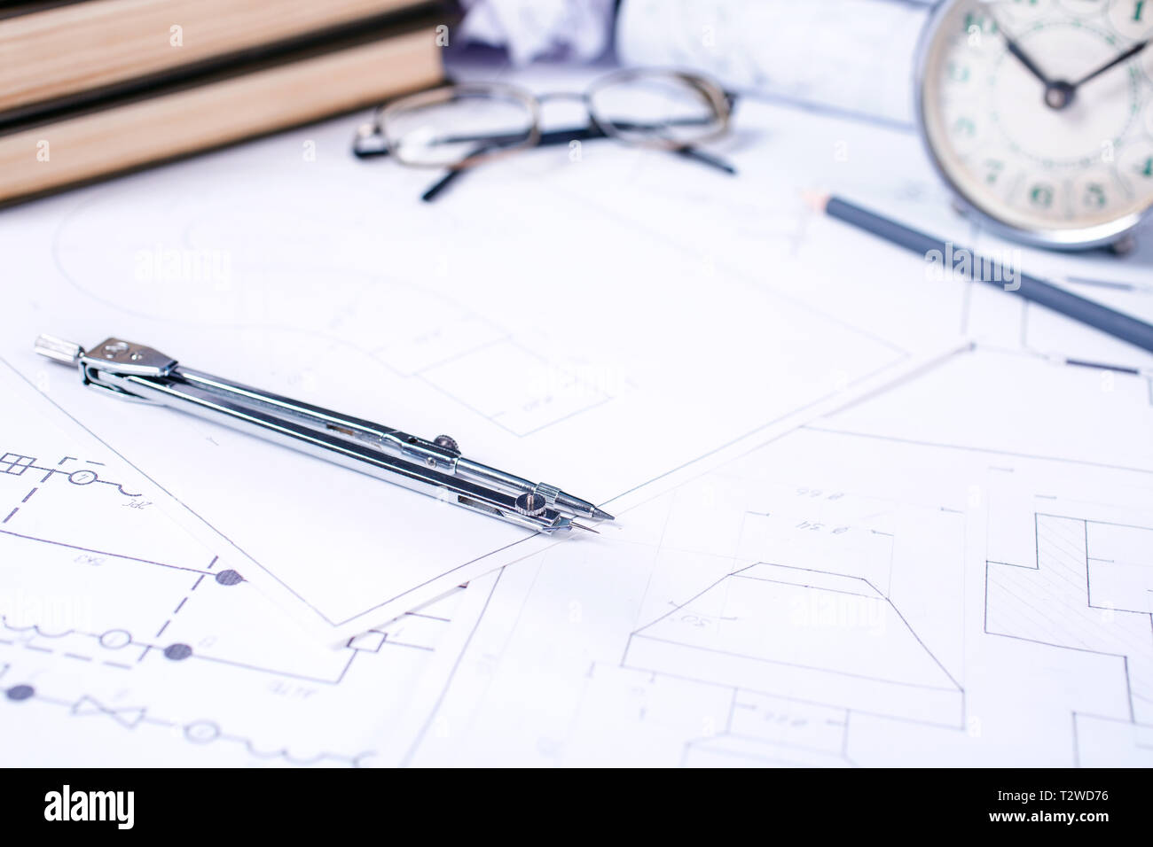 Old watch with eyeglasses and compass on industrial drawings ...