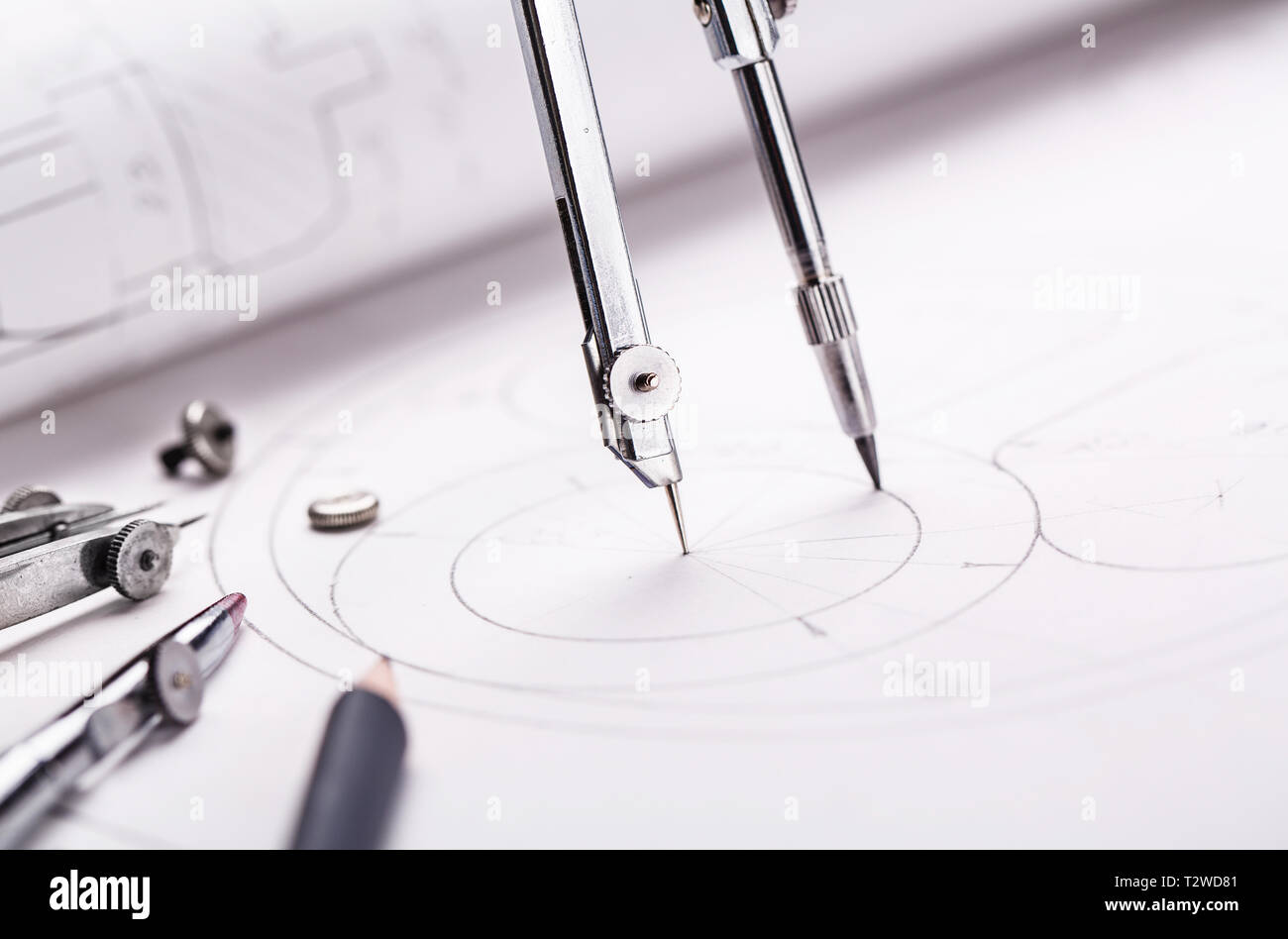 Compass drawing a circle on the drawing. Engineering and technology ...