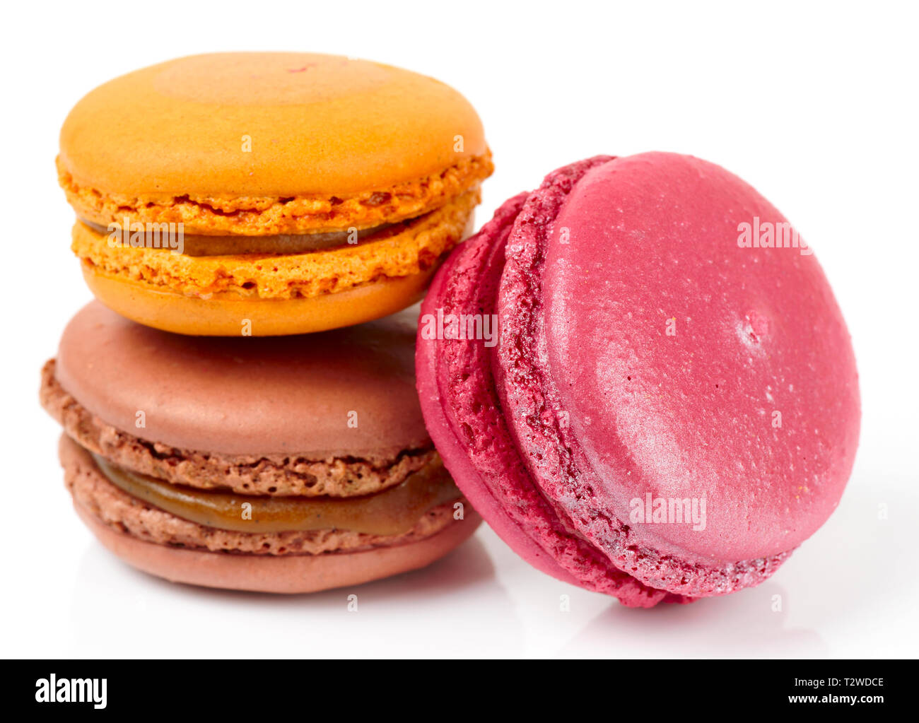 Three colorful macarons isolated on white background Stock Photo - Alamy