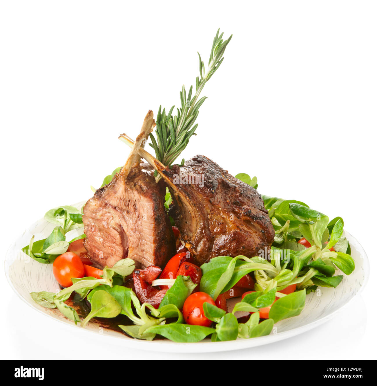 Rare fried rack of lamb isolated on white background Stock Photo - Alamy