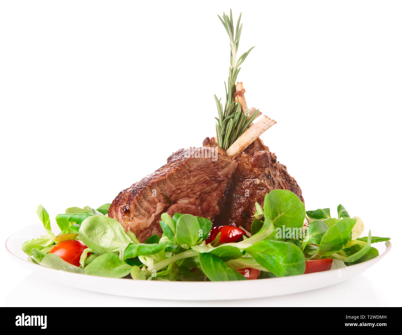 Rare fried rack of lamb isolated on white background Stock Photo - Alamy
