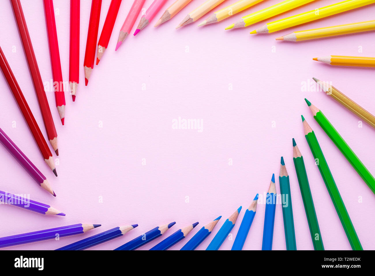 Colored pencils laid out in the form of an eye. Bright sharp pencils ...