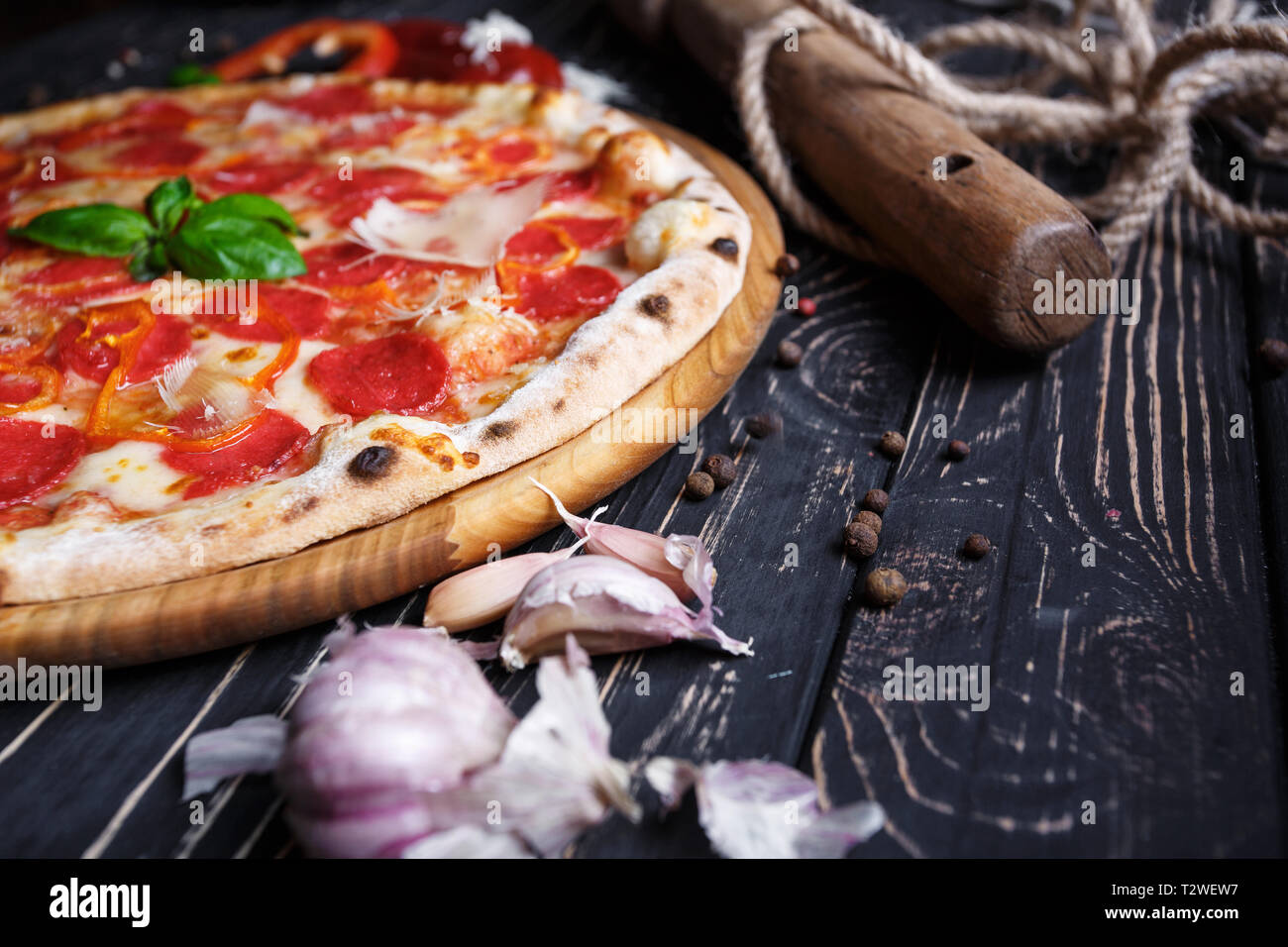 An appetizing pizza with garlic and fragrant pepper. As package design ...