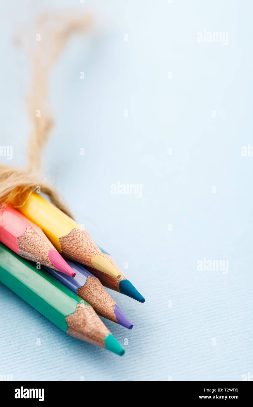 Pile of sharp coloured drawing pencils on table. 1 September concept ...