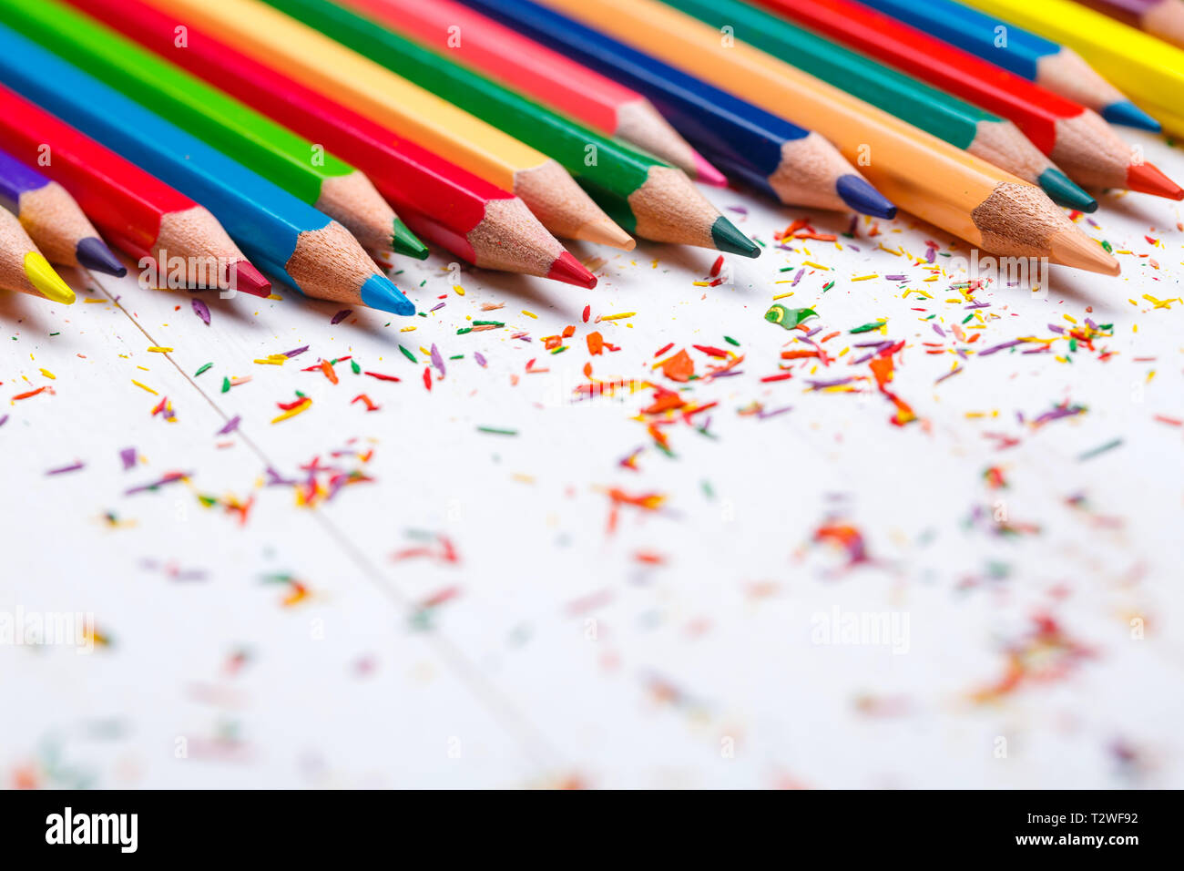 Pile of sharp coloured drawing pencils on table. Background ready for ...