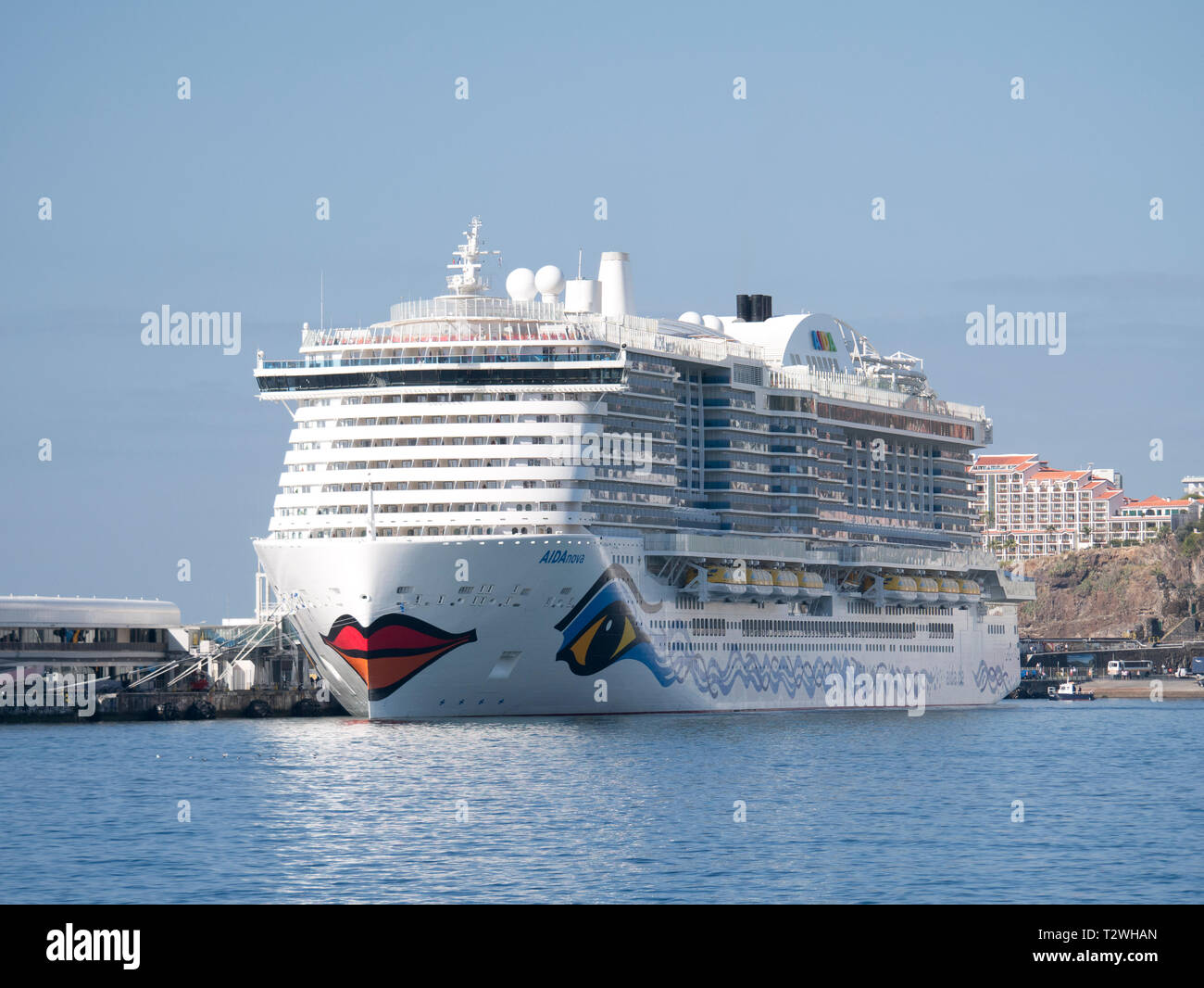 The AIDA Nova cruise ship in Funchal Harbour against a blue sky and a ...