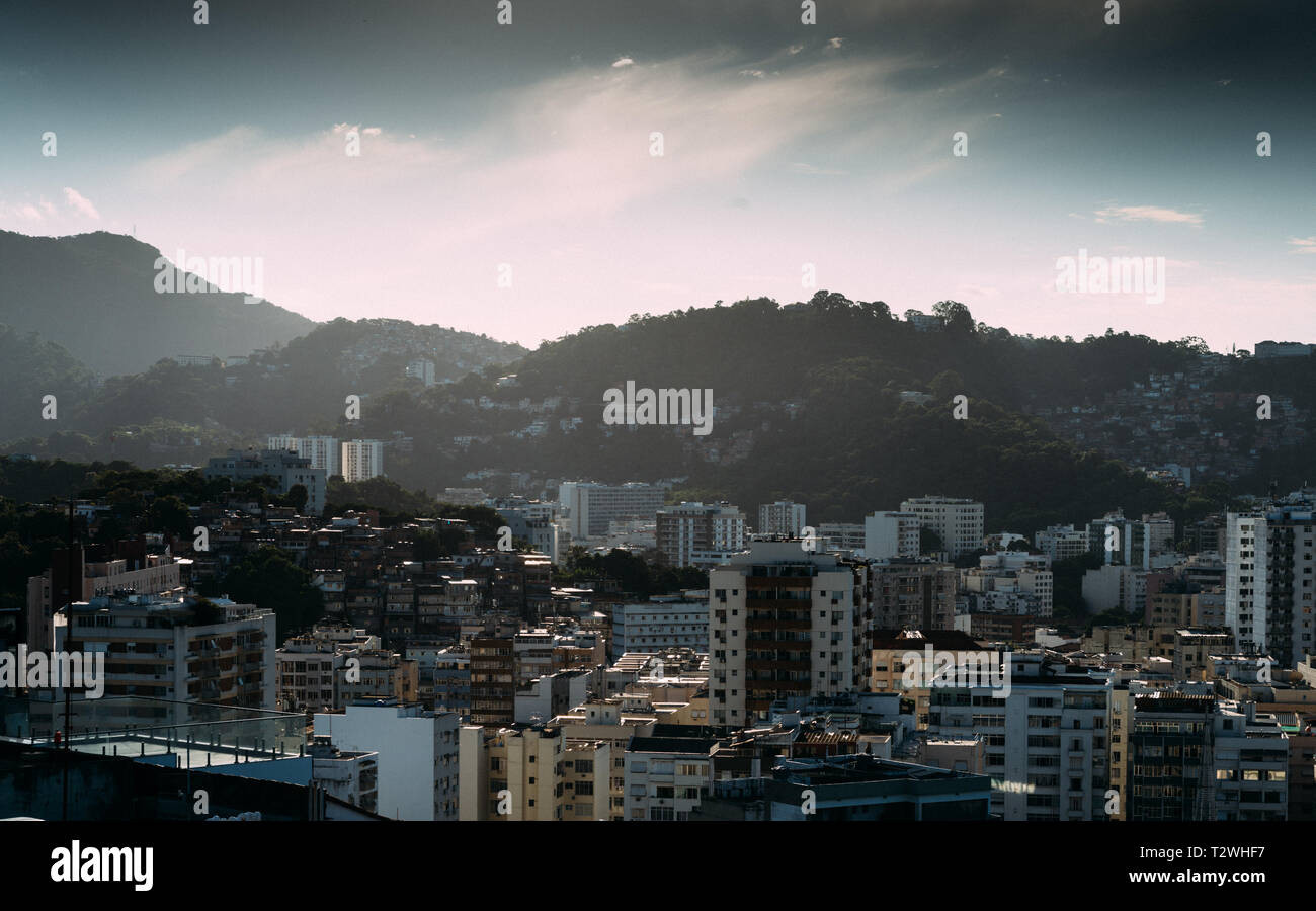 Cityscape of high rises with a favela in background, Rio de Janeiro ...