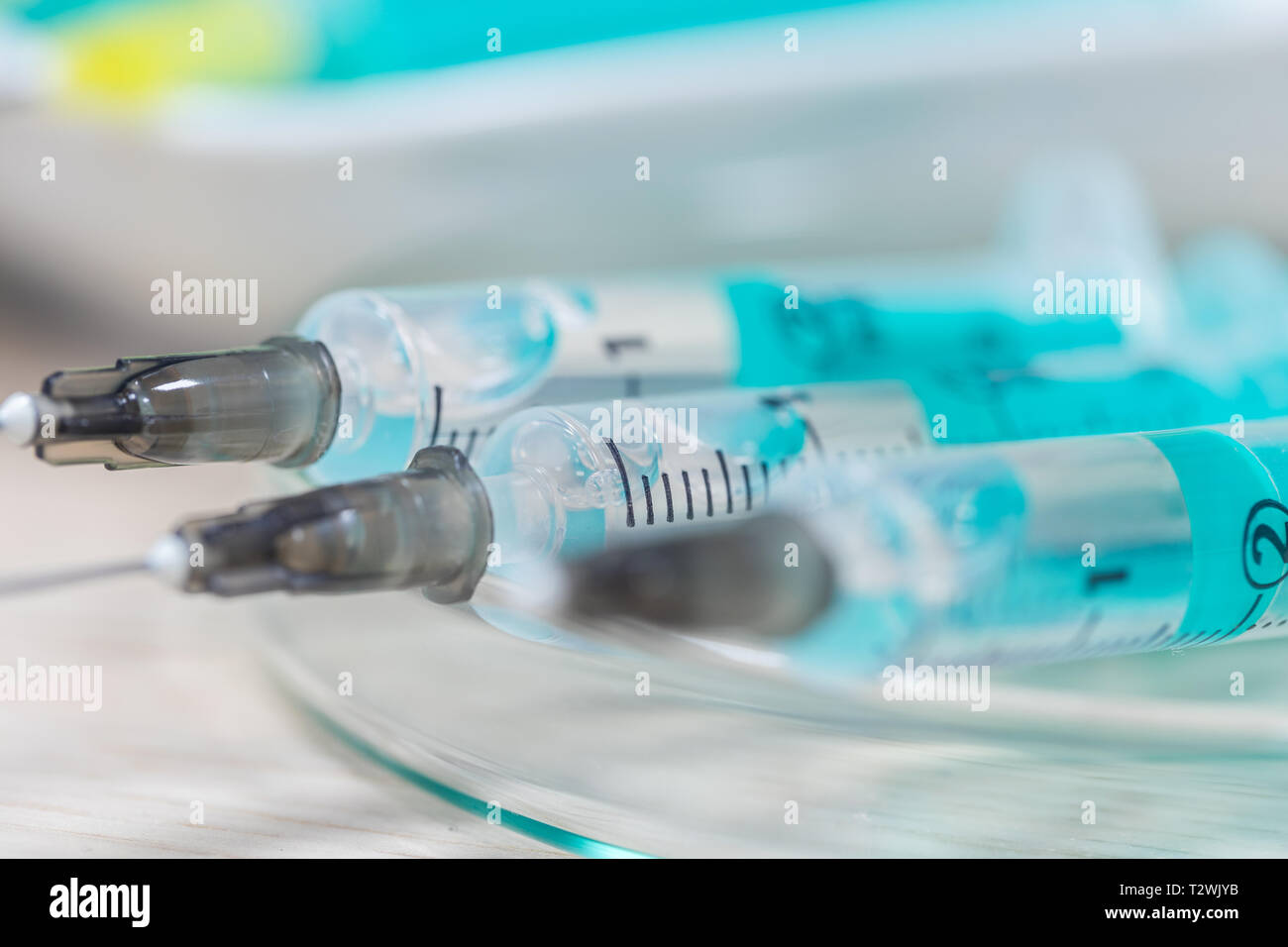 many medical syringes background Stock Photo - Alamy