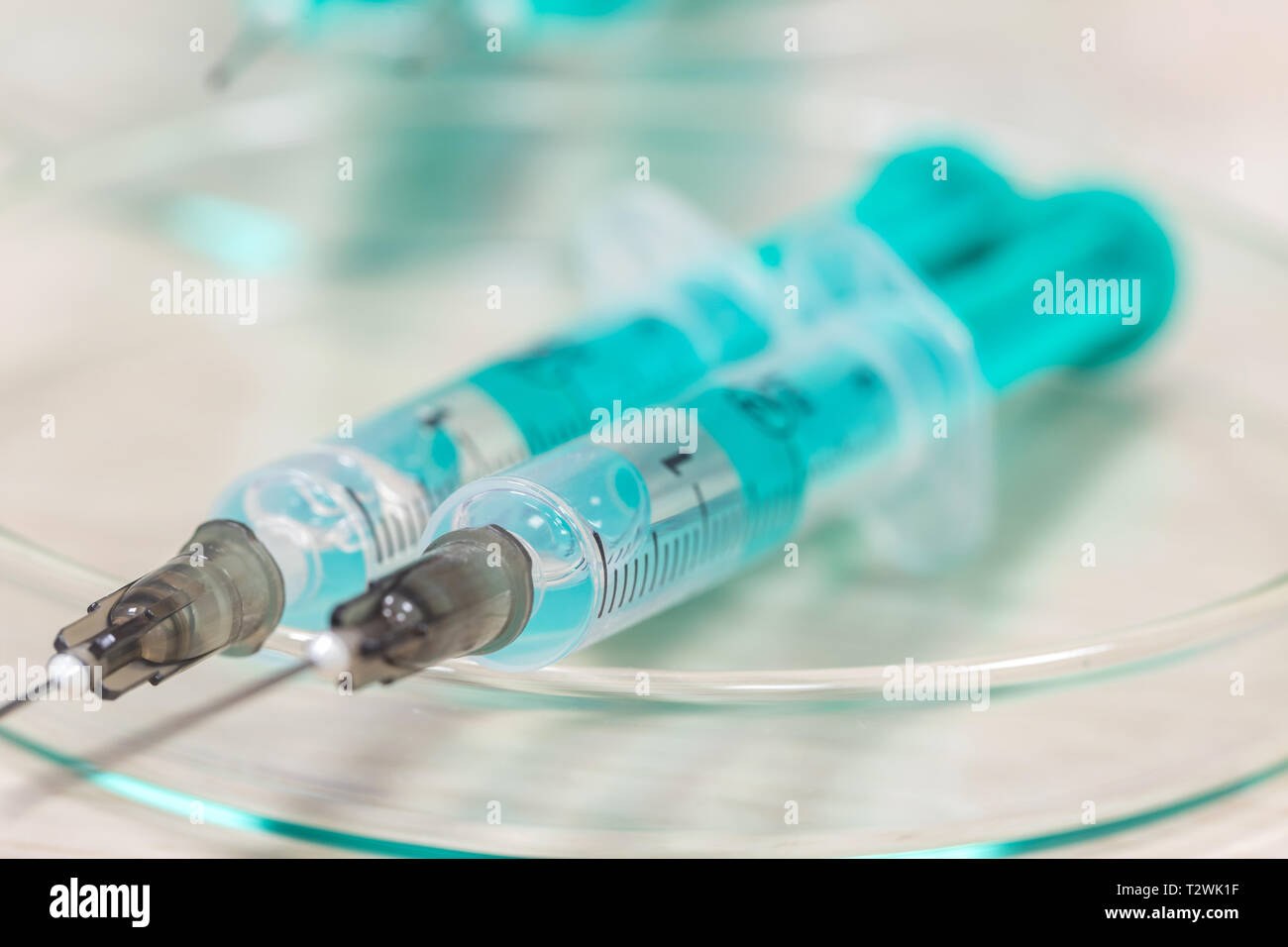 two syringes background Stock Photo - Alamy