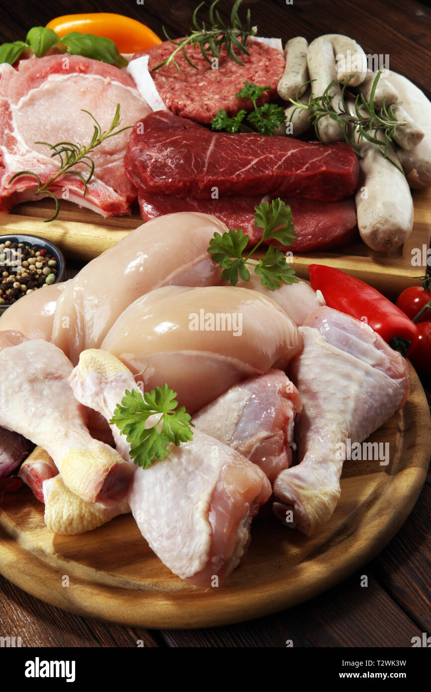 raw meat. Different types of raw pork meat, chicken and beef with ...