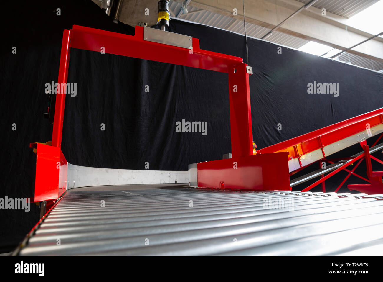 Empty conveyor sorting belt at distribution warehouse. Distribution hub ...