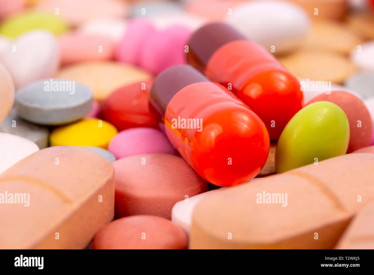 Different colorful pills and capsules. Global pharmaceutical industry ...