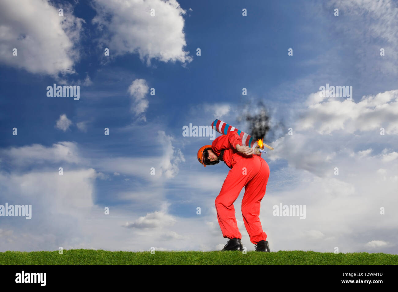 Stuntman igniting a rocket strapped to his back Stock Photo - Alamy
