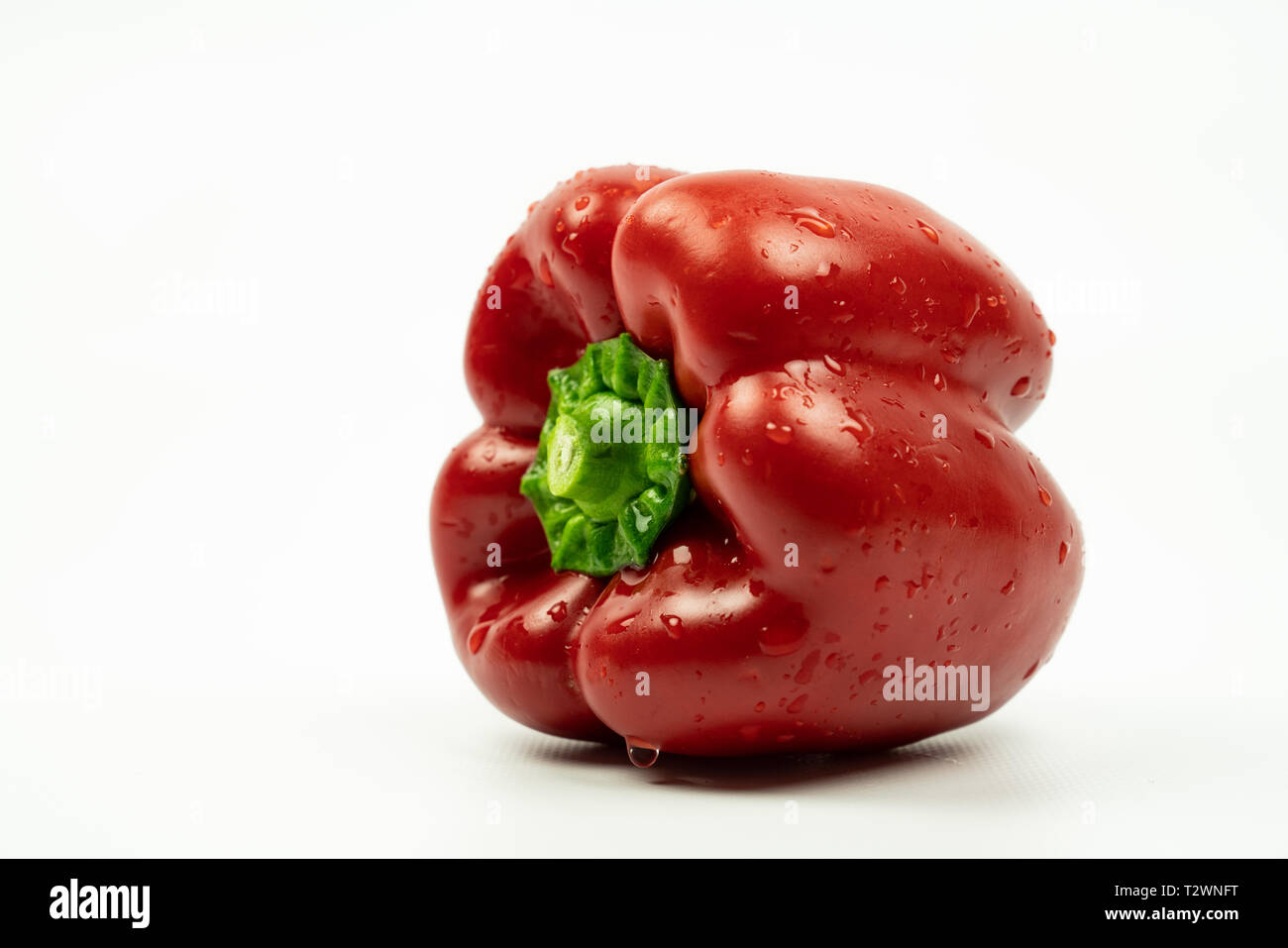 fresh red paprika isolated on a white background Stock Photo - Alamy