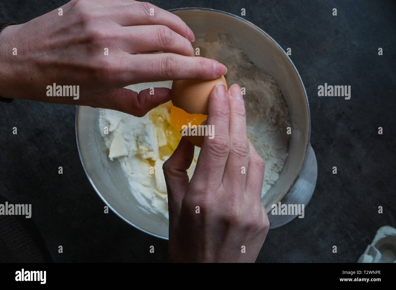 Hand breaking egg hi-res stock photography and images - Alamy
