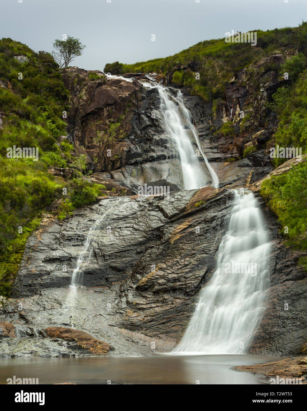 Blackhill waterfall cascades down over rocks on the Isle of Skye ...
