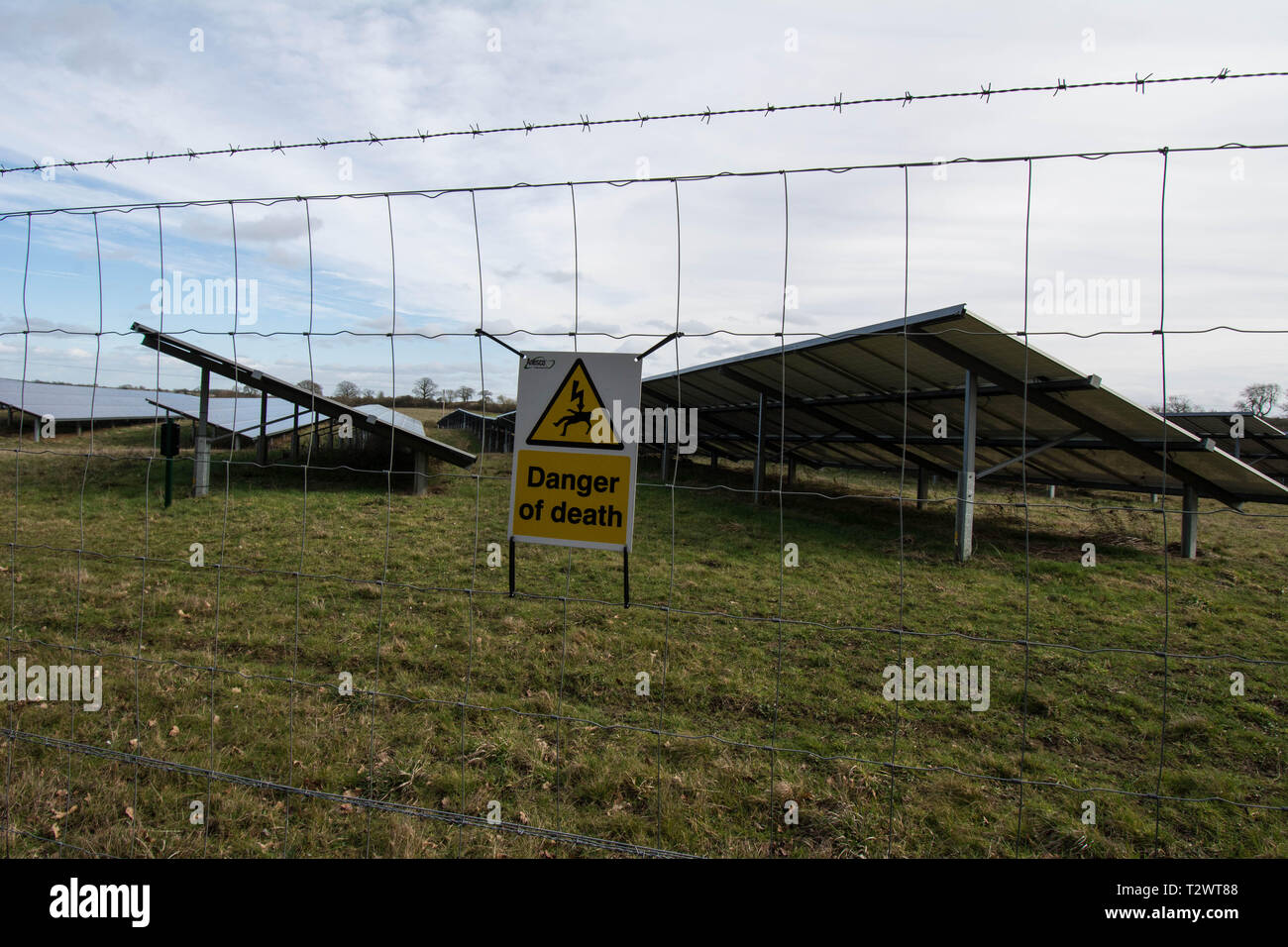 Danger sign for solar panels in Salcey forest Northamptonshire UK with ...