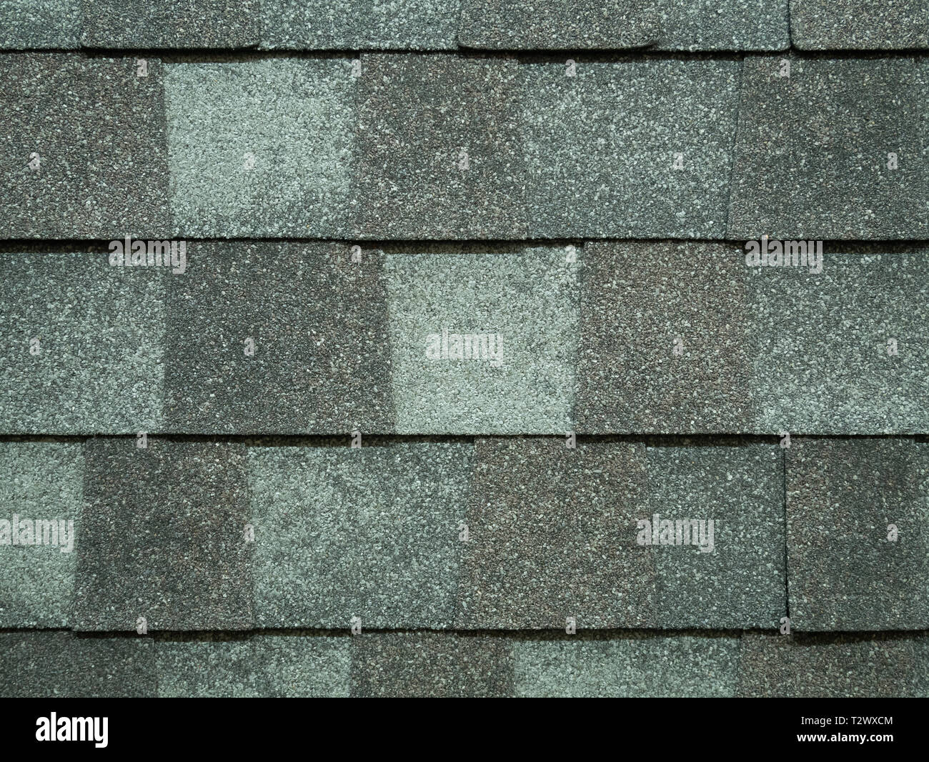 closeup of modern roof trapezoid square shingles tiles in gray color ...