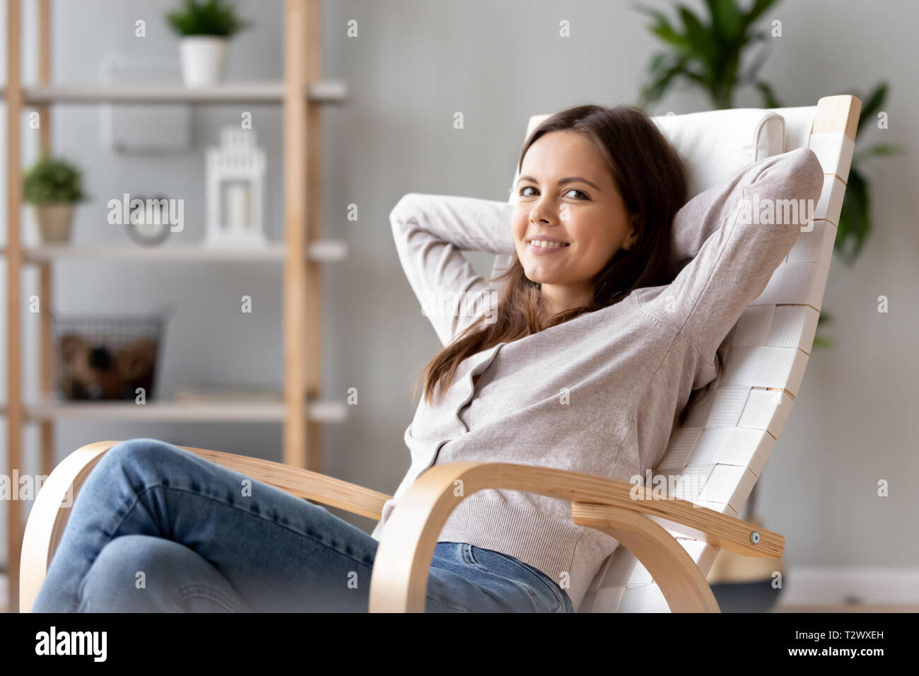 Woman sitting on rocking chair hi-res stock photography and images - Alamy