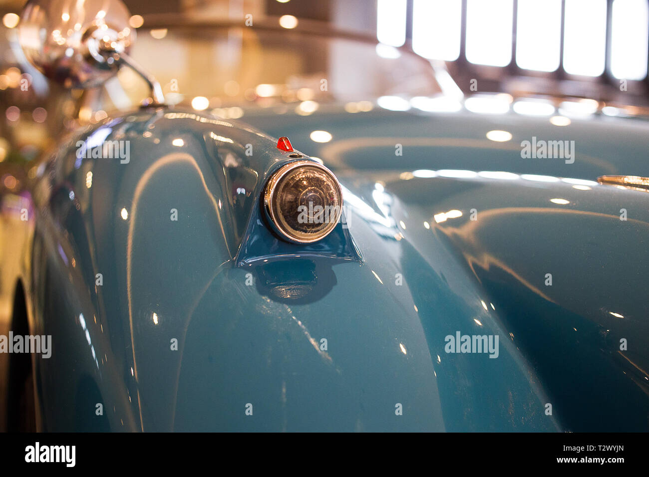 Concept of a classic blue convertible car with right indicator in a ...