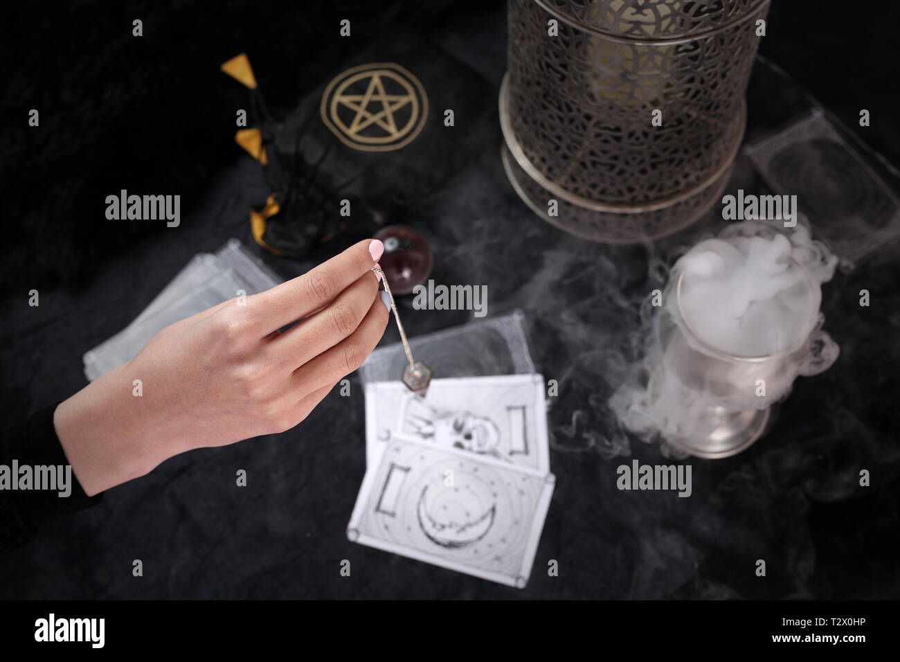 Fortune-telling, the fortune-teller puts tarot cards and spells the ...