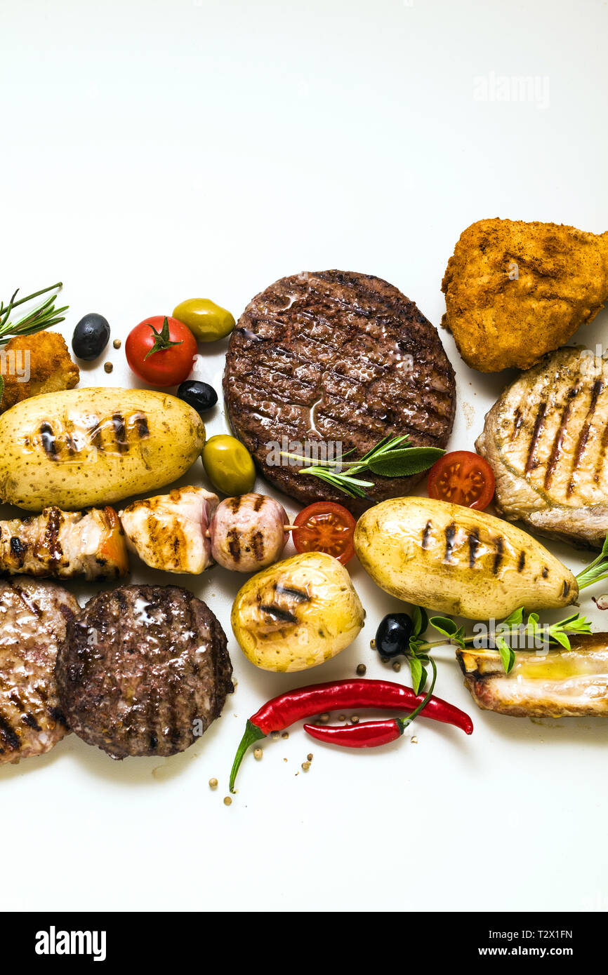 BBQ meat party with different types of meat: beef burgers, pork ribs ...
