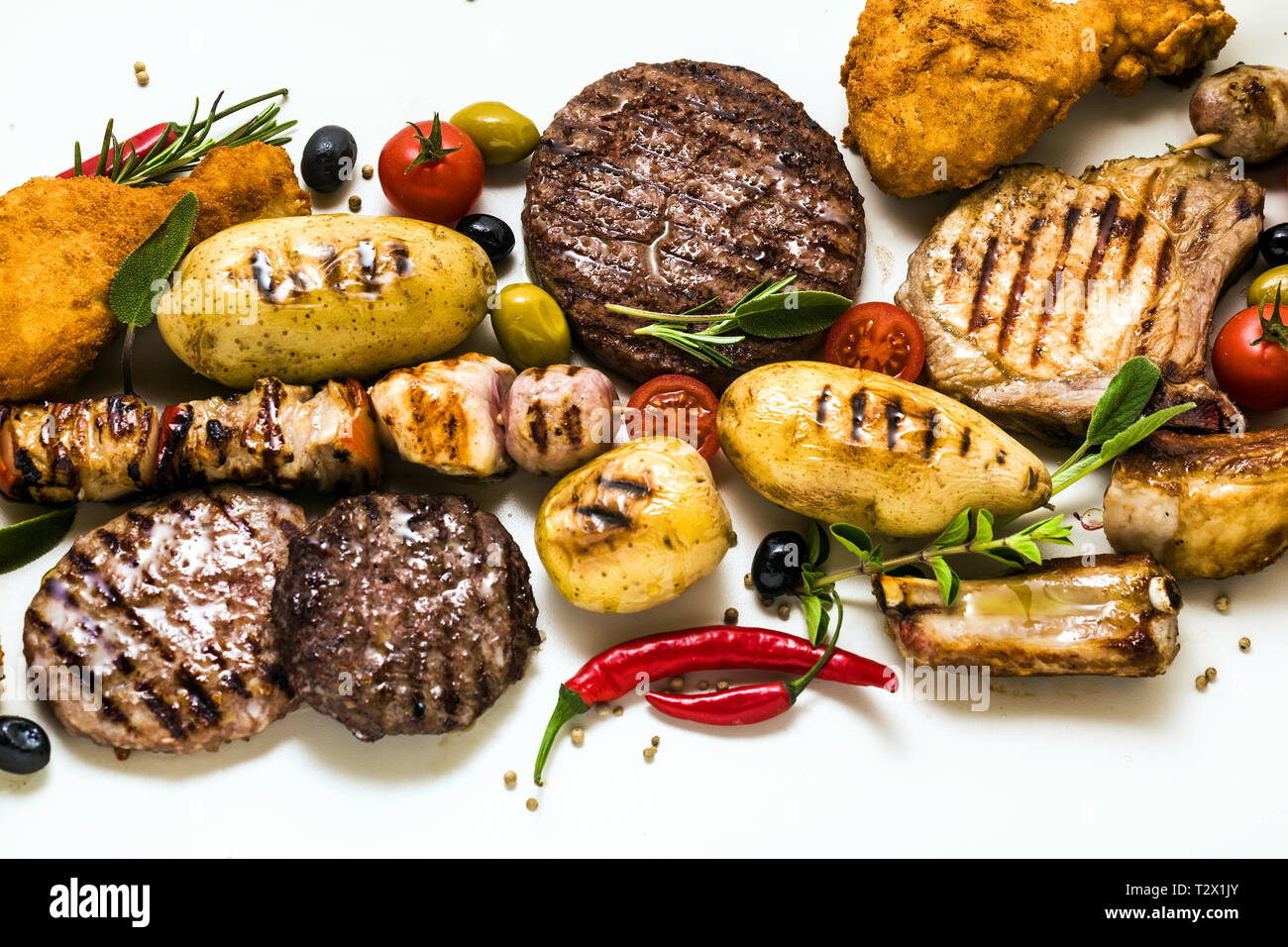 BBQ meat party with different types of meat: beef burgers, pork ribs ...