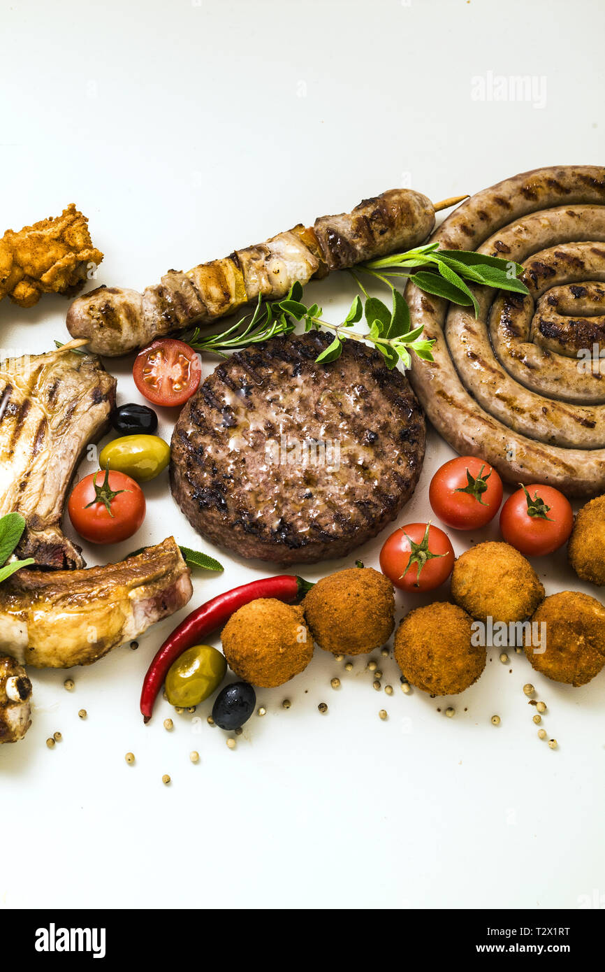 BBQ meat party with different types of meat: beef burgers, pork ribs ...