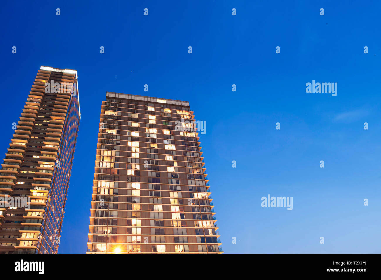 Modern apartment block at night Stock Photo - Alamy