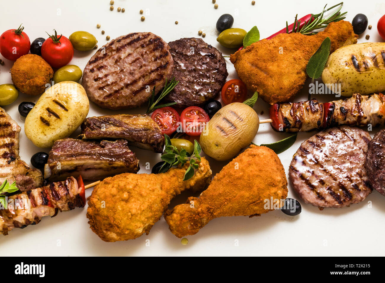 BBQ meat party with different types of meat: beef burgers, pork ribs ...