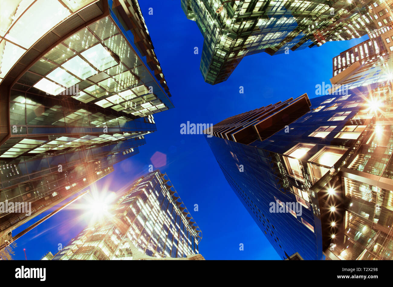 Low angle fish eye view of office buildings at dusk Stock Photo - Alamy