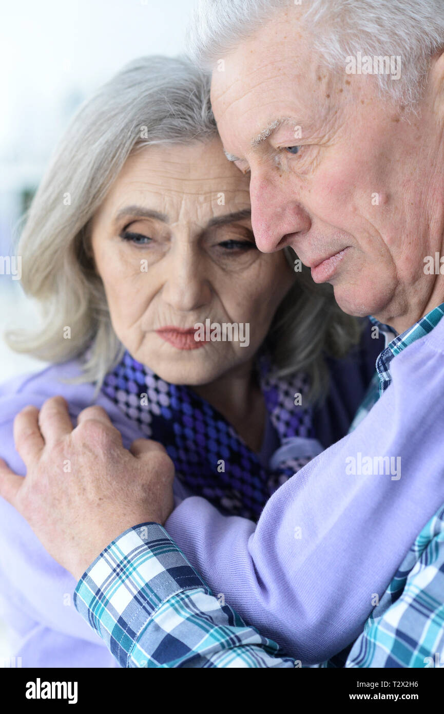 Portrait of a sad senior couple posing Stock Photo - Alamy