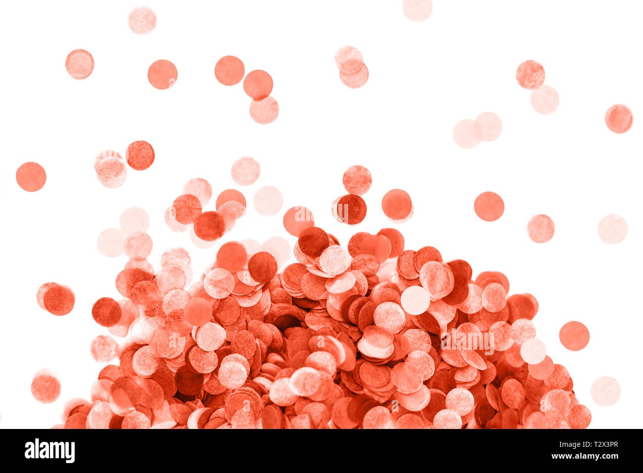 Bright coral confetti isolated on a white background. Festive concept ...