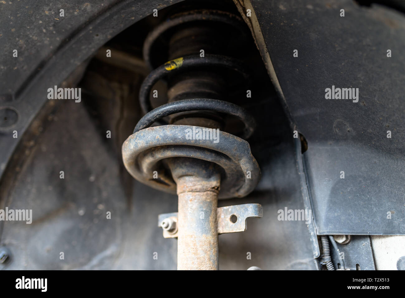 The front suspension of the car visible from the bottom, the suspension ...