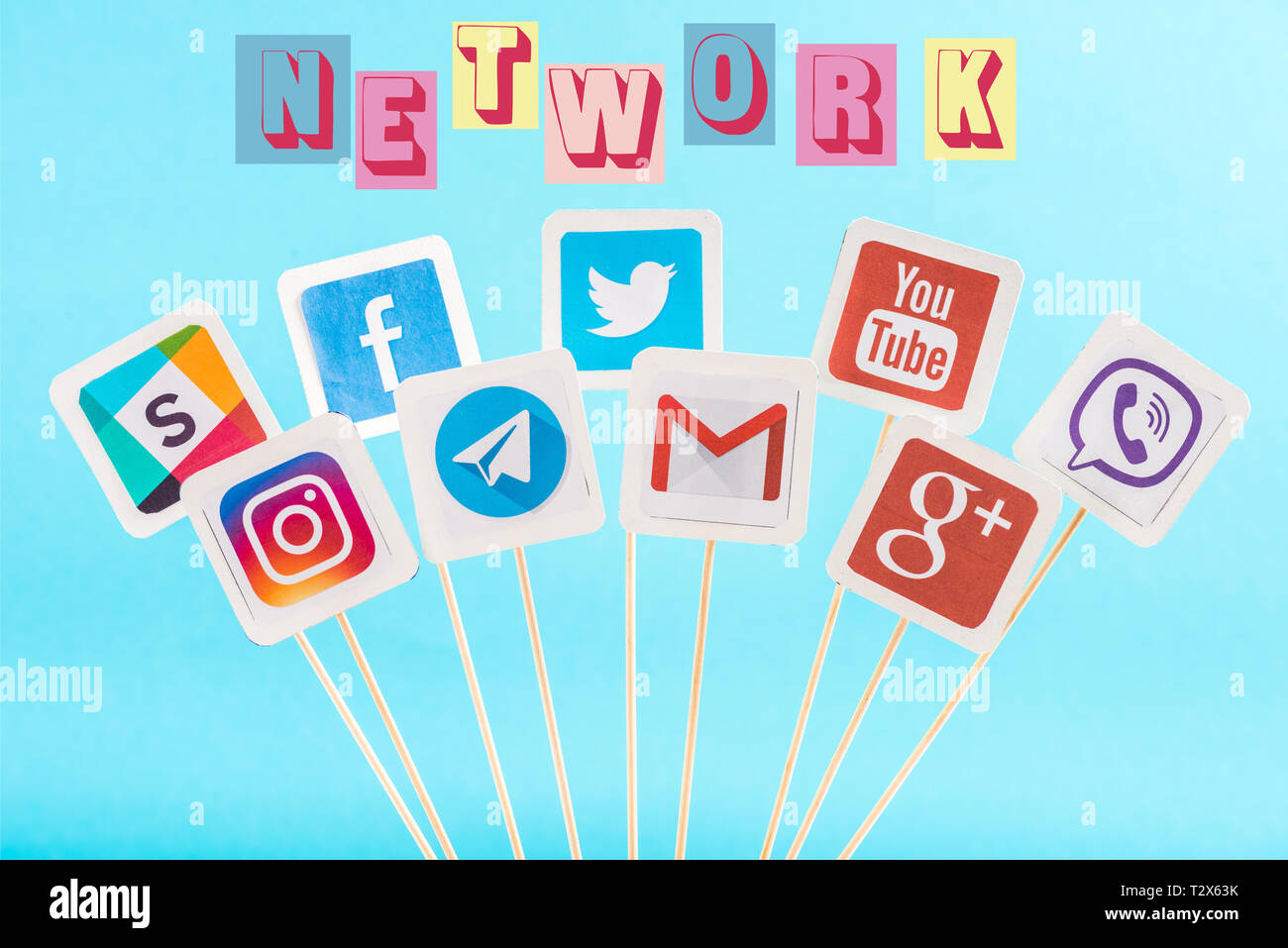 social media icons and network multicolored lettering isolated on blue ...