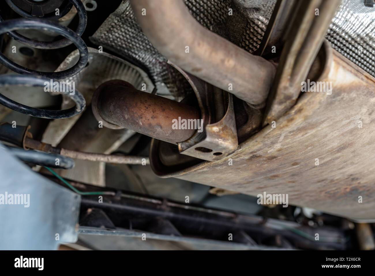 The exhaust system in the car seen from below, the car is on the lift ...