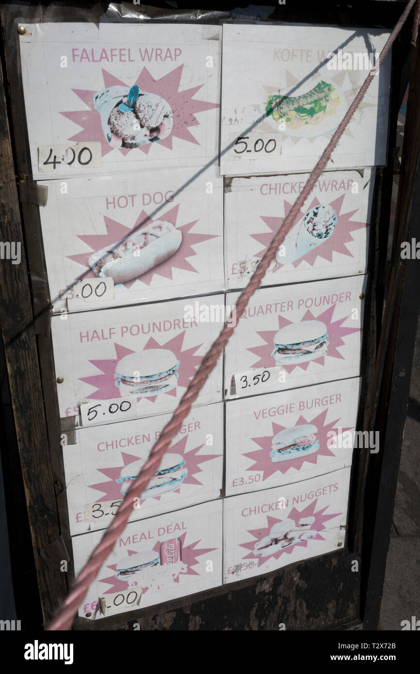 Poor diet and nutrition from a fast food menu on sale in Aldwych in ...