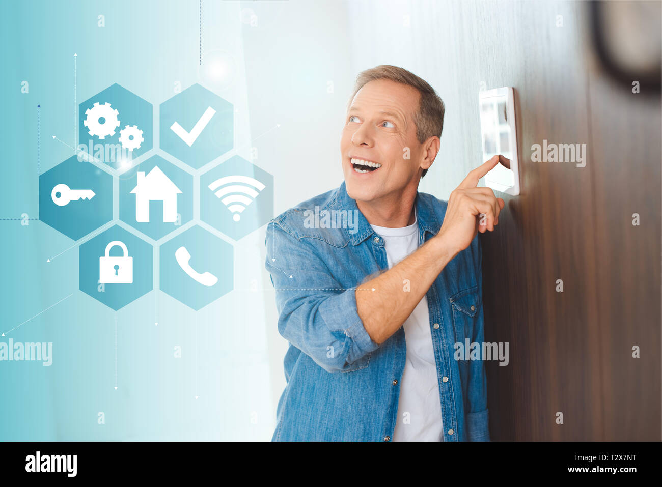 happy handsome man using smart house system control panel Stock Photo ...