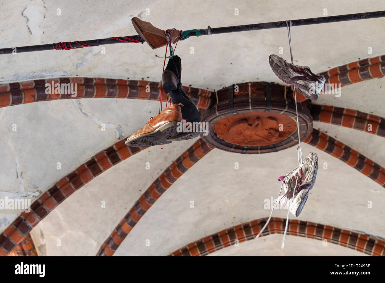 Shoe tossing (also known as Shoefiti) across a wire inside the Oberbaum ...