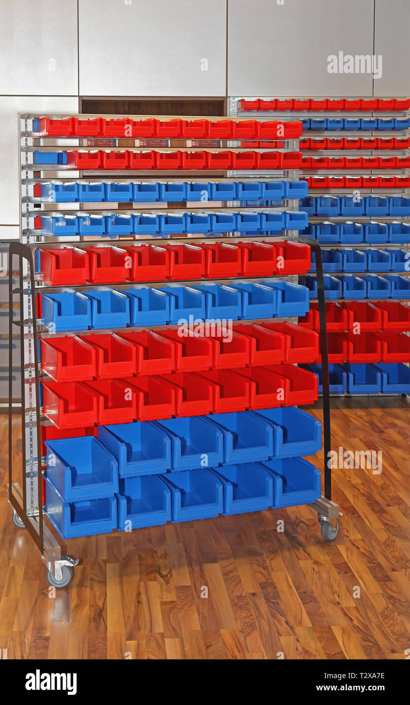 Sorting Tubs and Bins Storage Cart in Warehouse Stock Photo - Alamy