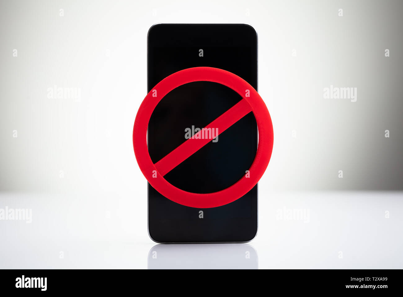 Close-up Of Red No Sign On Mobile Phone Against White Background Stock ...