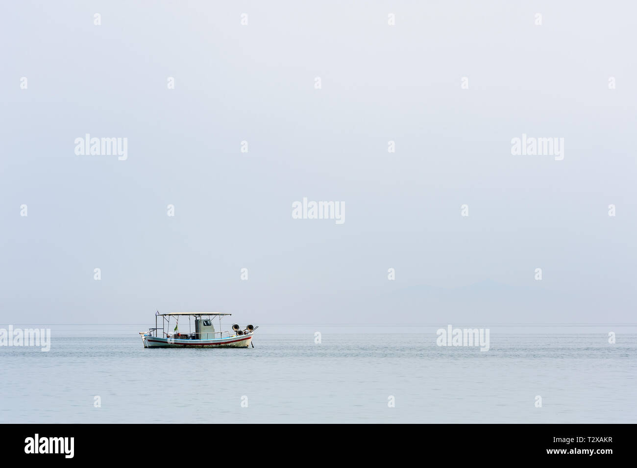 Two small fishing boat at sea surface Stock Photo - Alamy