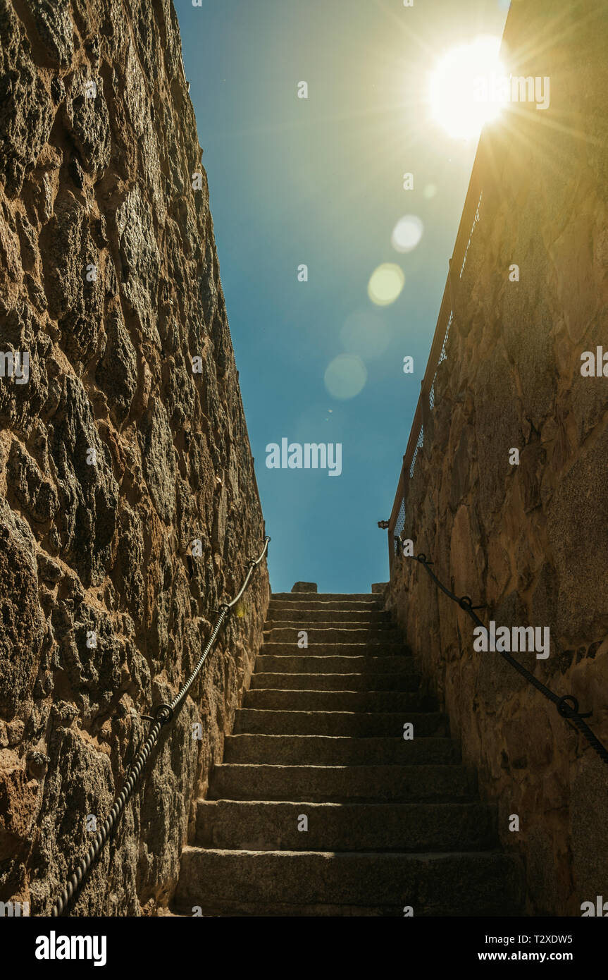 Staircase made of stone bricks going up towards a thick wall around the ...