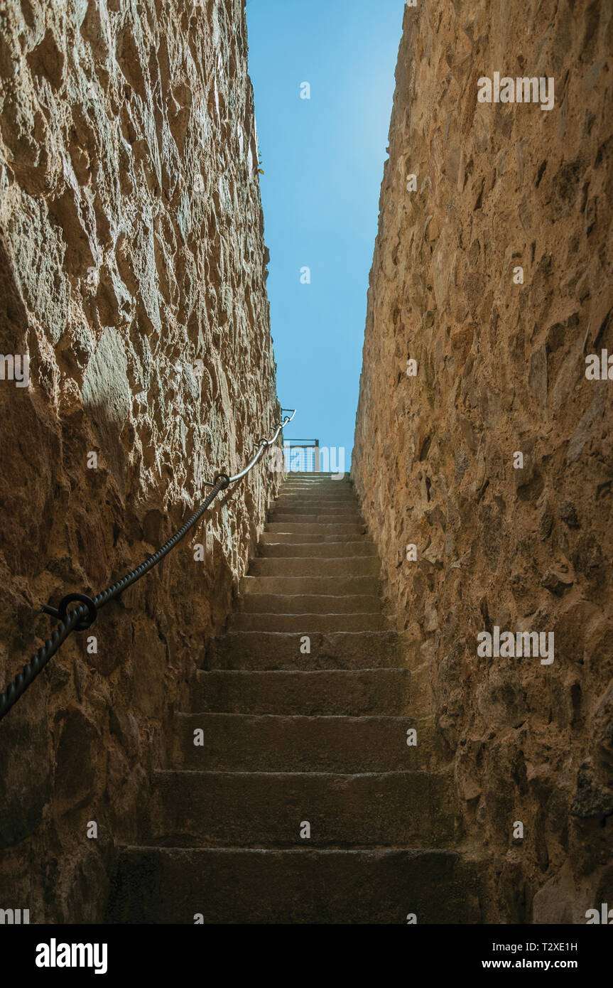 Staircase made of stone bricks going up towards a thick wall around the ...